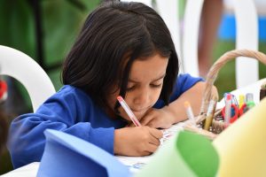 day 1 - girl concentrating colouring - Move Revolution